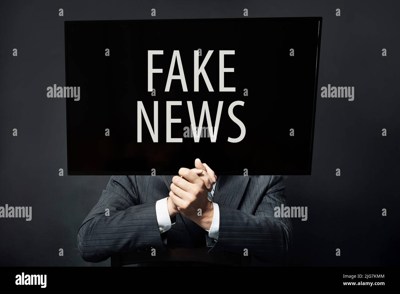 Businessman with TV head standing on black background. Fake news, lie ...