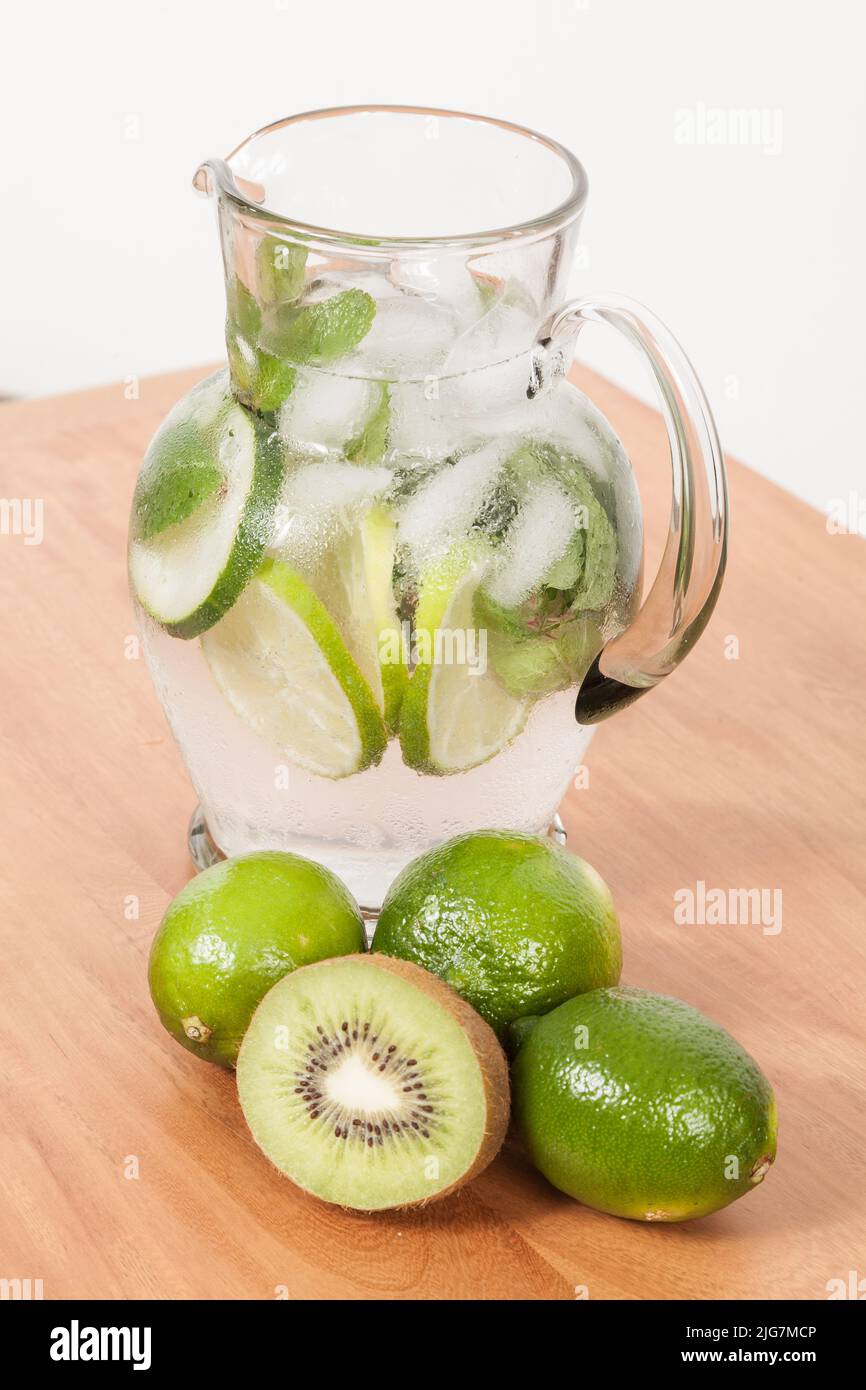 Homemade refreshing natural water flavored with lemon, kiwi and mint leaves Stock Photo - Alamy