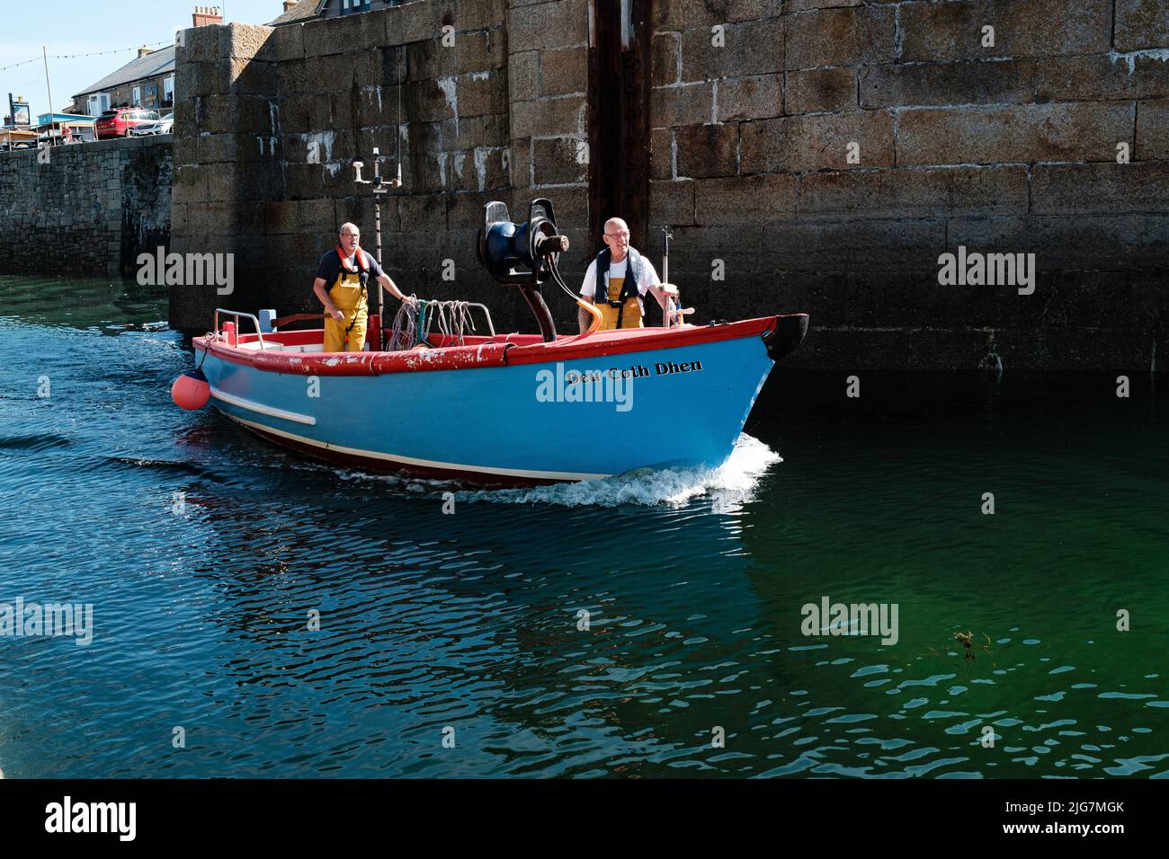 Fishing Boats entering and leaving harbour at Porthleven, Cornwall ...
