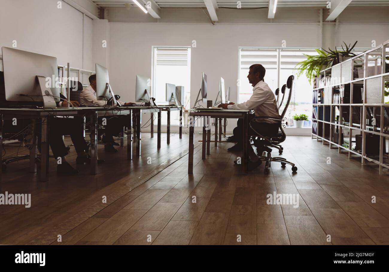 Interior of a modern light small company office. Workspace, office ...
