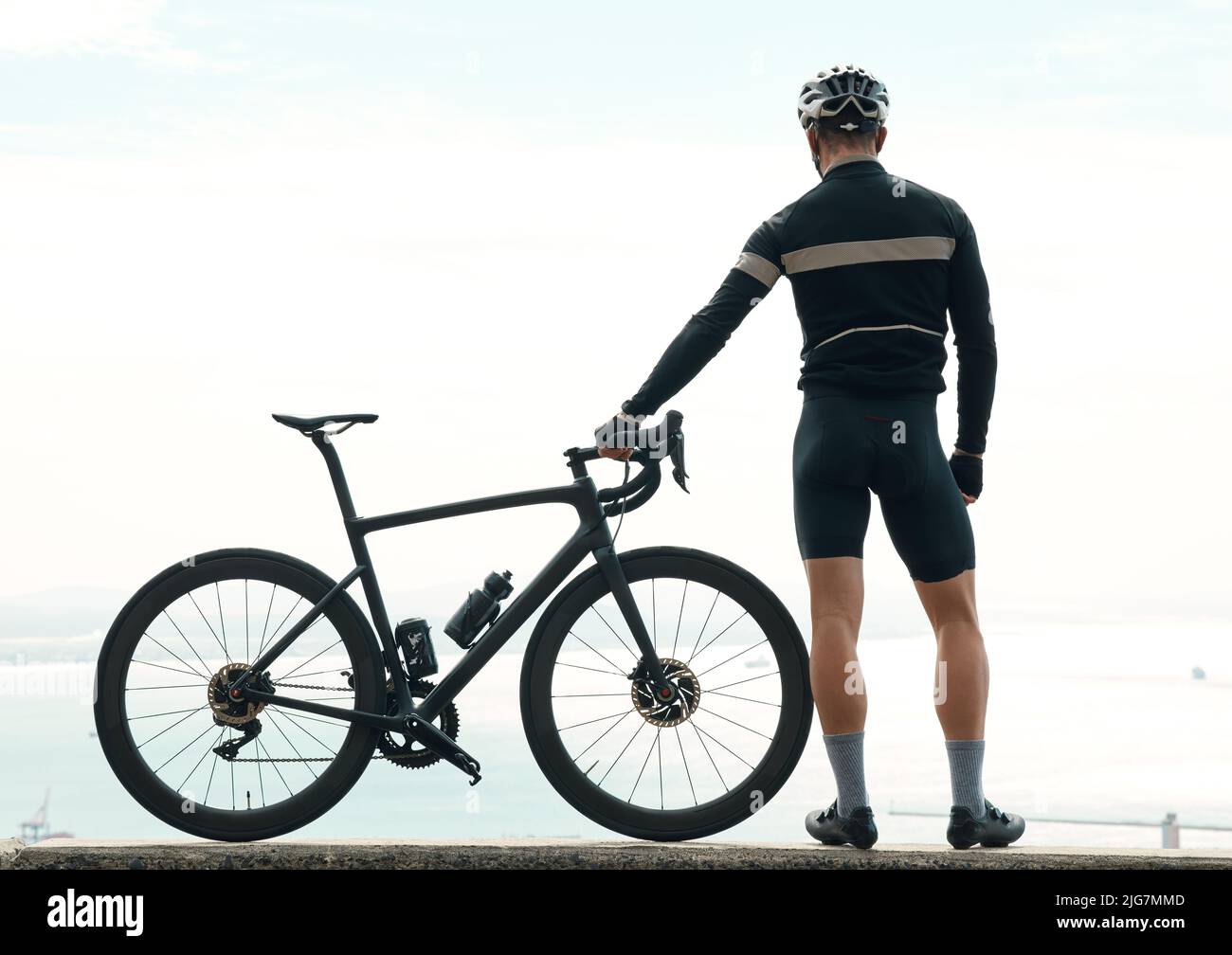 A perfect viewpoint. Rearview shot of an unrecognizable man taking a ...