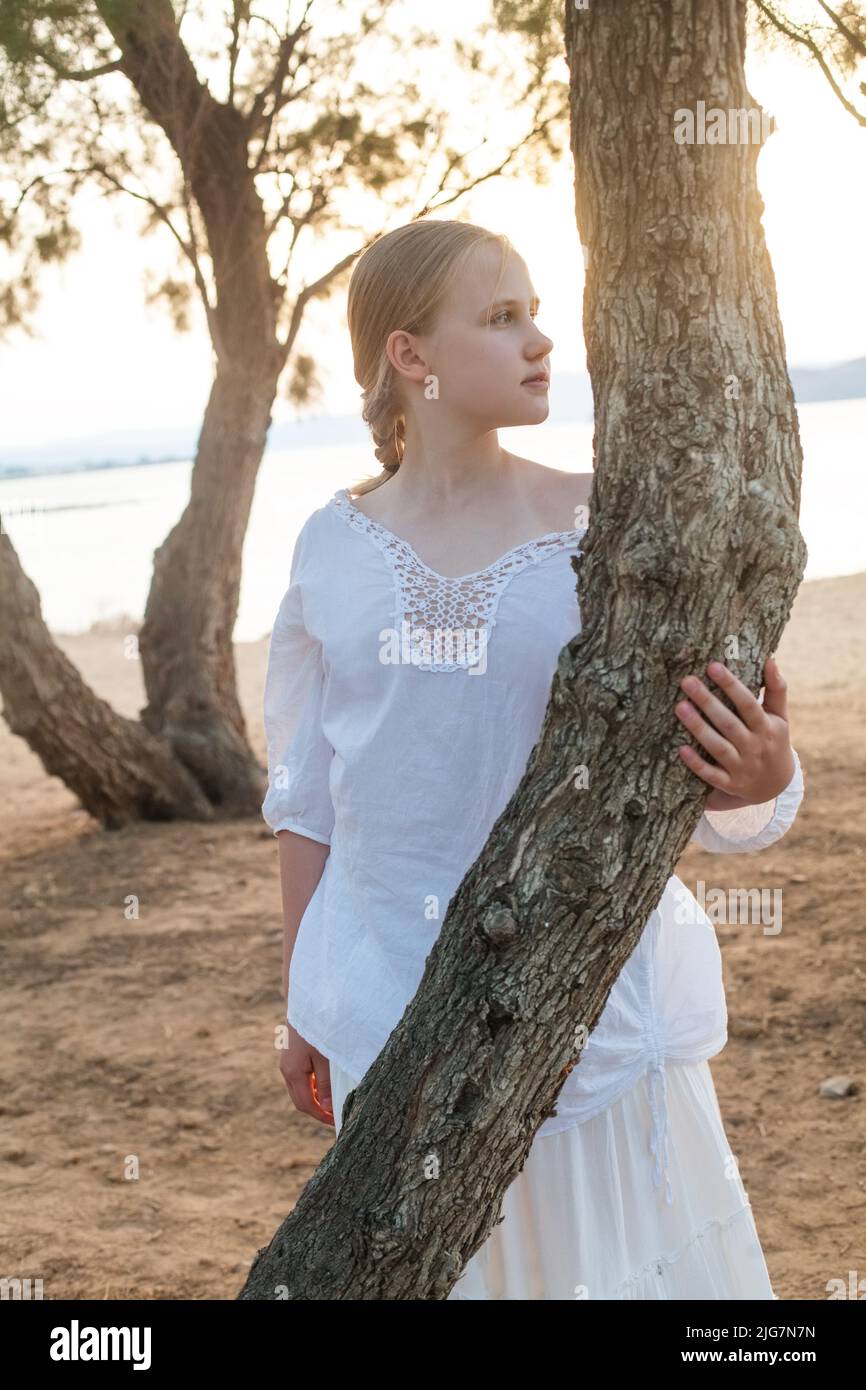 Teen girl near tree outdoors portrait Stock Photo - Alamy