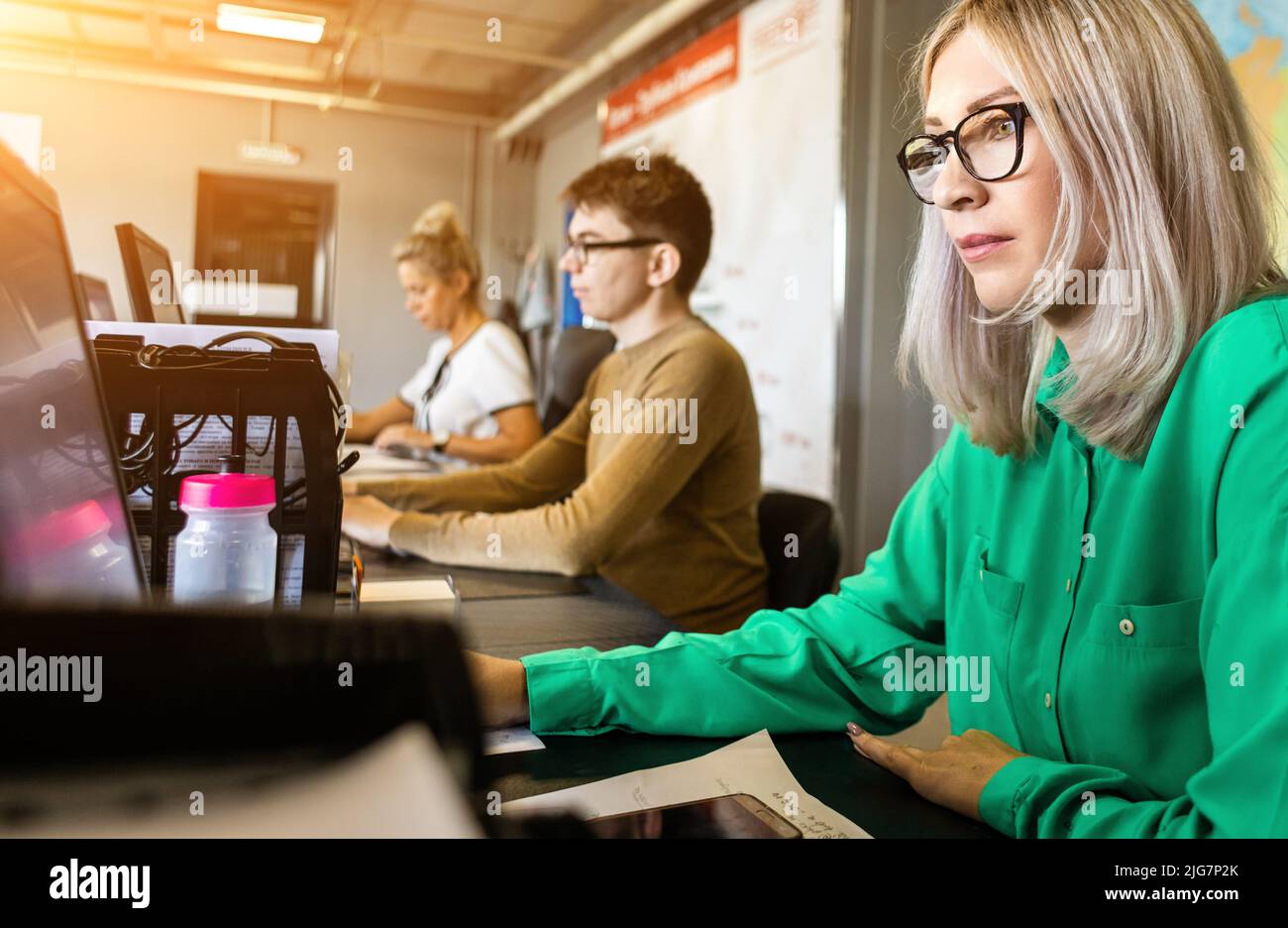 Engineer designer working on desktop computer in factory Stock Photo ...