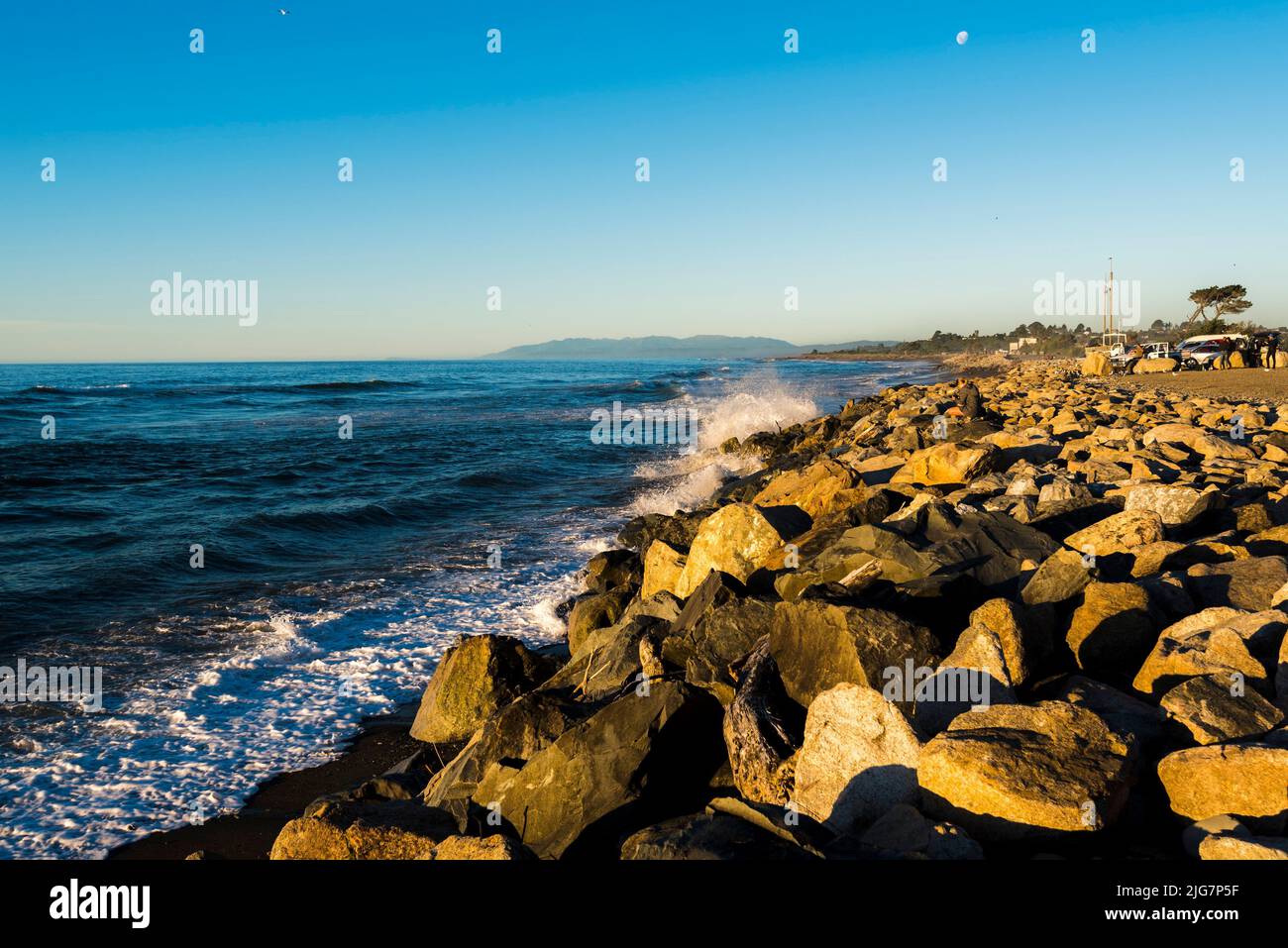 The rocks on Hokitika beach with the sea in South Island, New Zealand ...