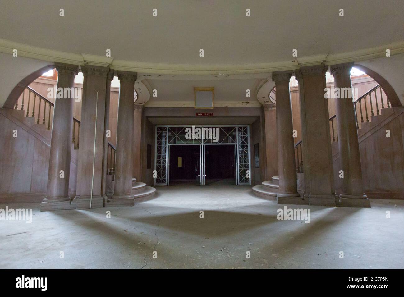 The entrance gate of a big building with marble columns in the design ...