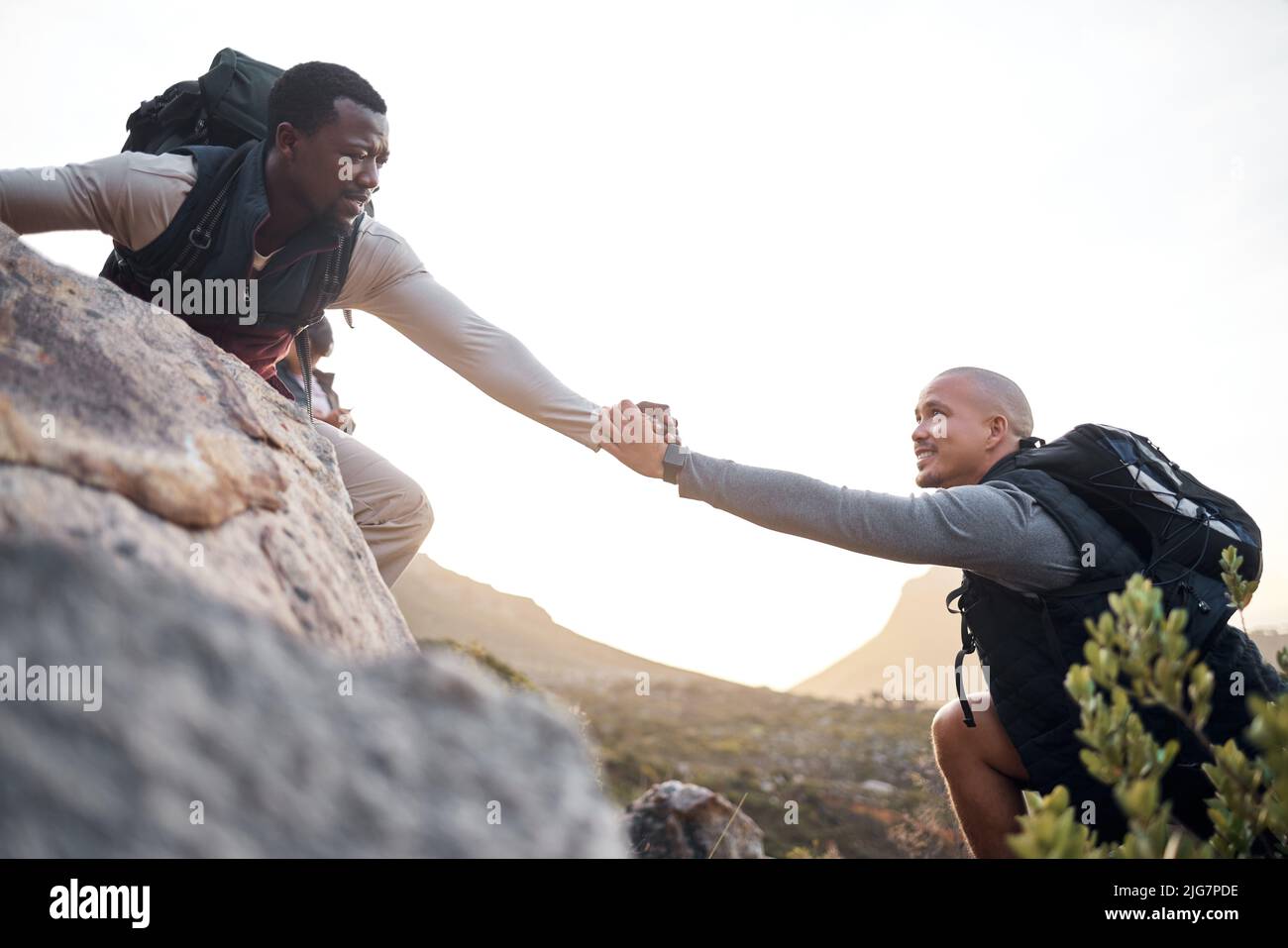 We go further when we work together. Cropped shot of a handsome young ...