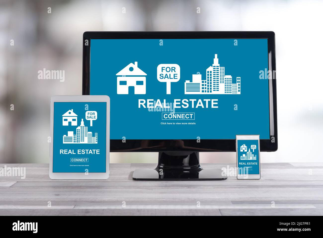 Real estate concept shown on different information technology devices ...