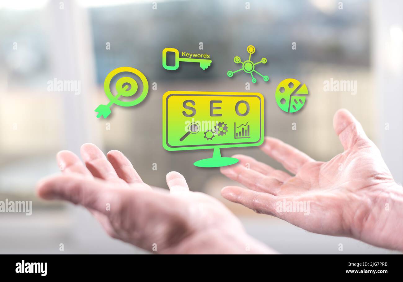 Seo concept above the hands of a man Stock Photo - Alamy
