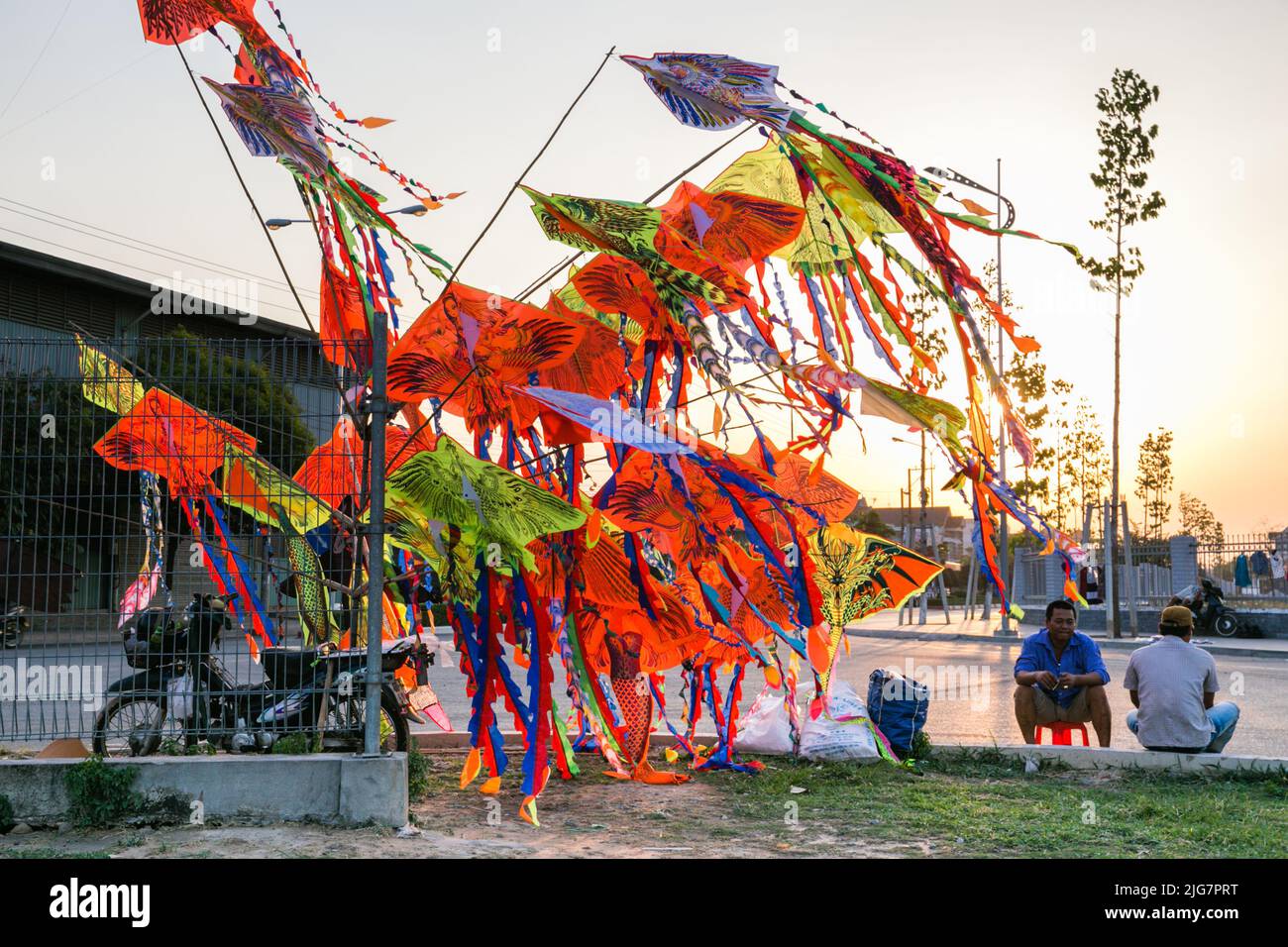 In summer many handmade kites are sold by the roadside. Kites with ...