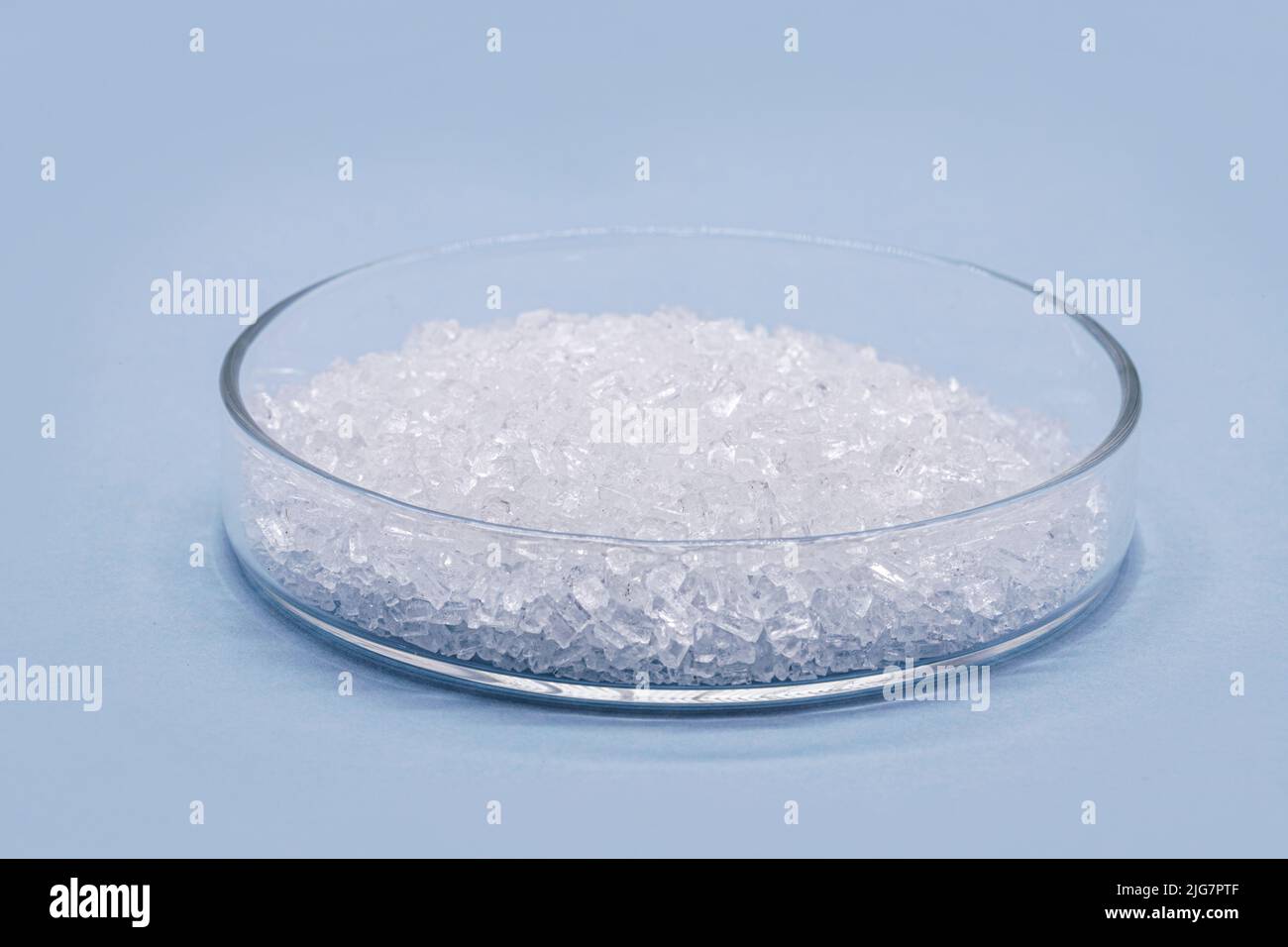sodium chloride in petri dish, known as salt or table salt, important ...