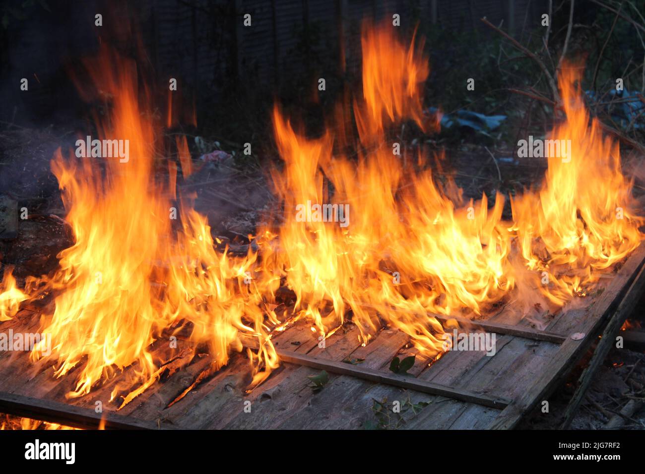 Wood decking on fire Stock Photo - Alamy
