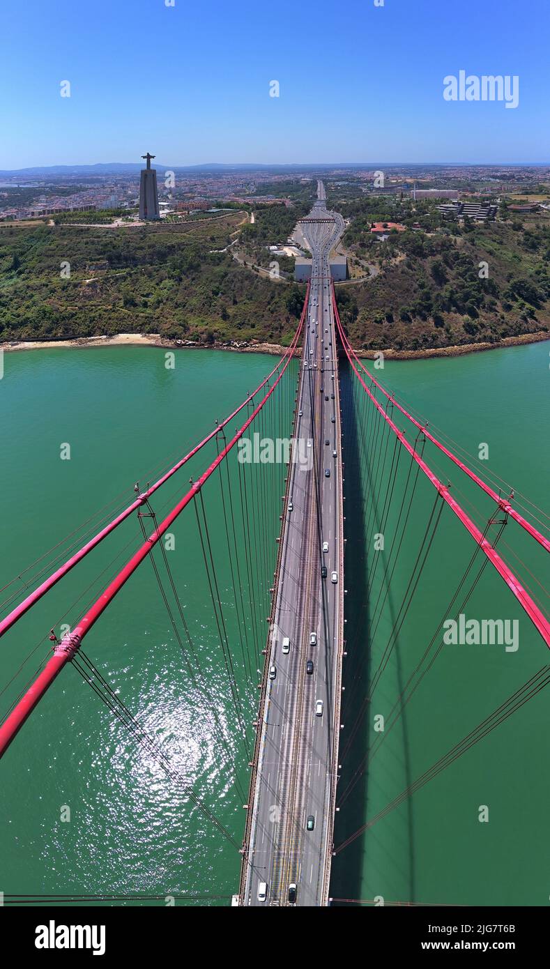 A vertical high-angle shot of the 25th April Bridge in Portugal Stock ...