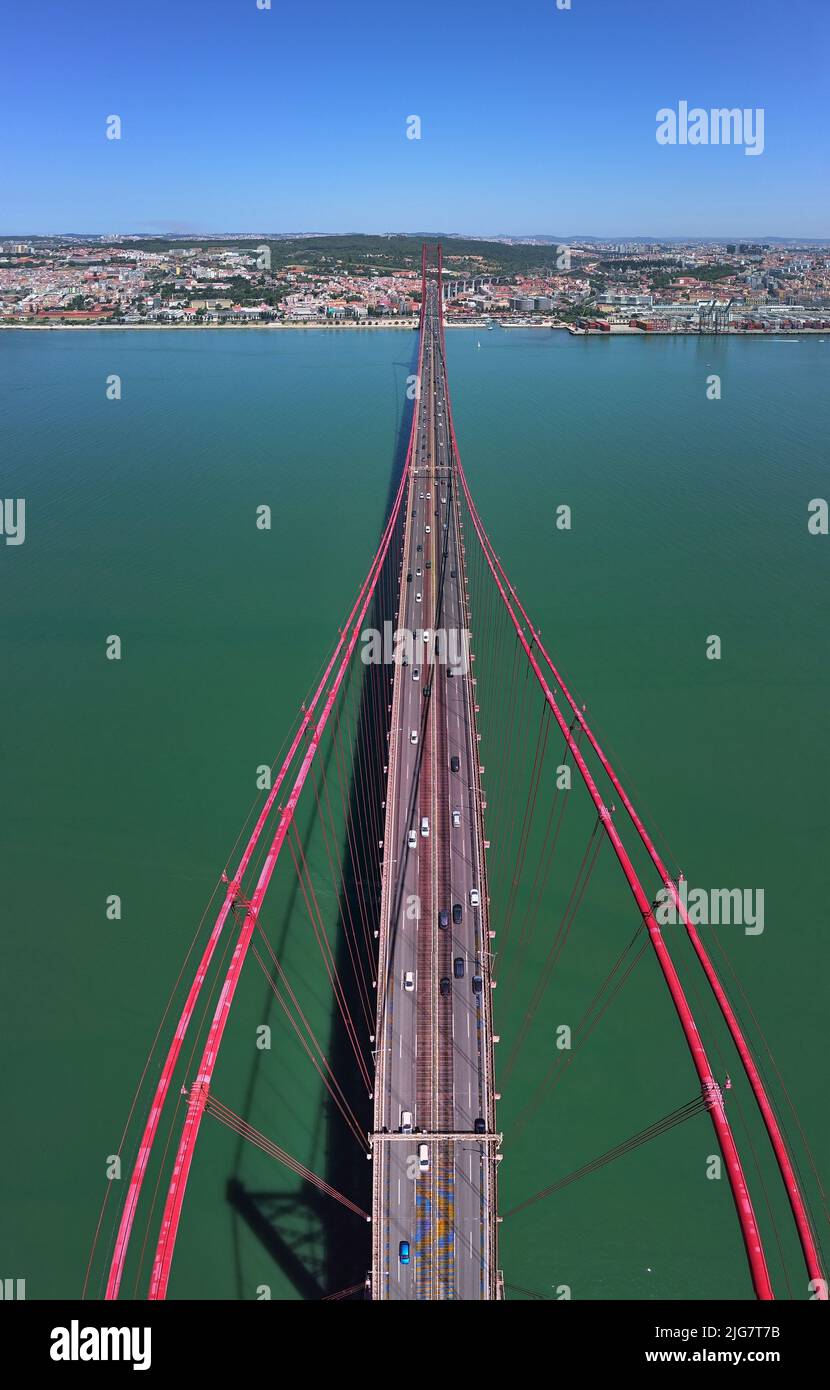 A vertical high-angle shot of the 25th April Bridge in Portugal Stock ...
