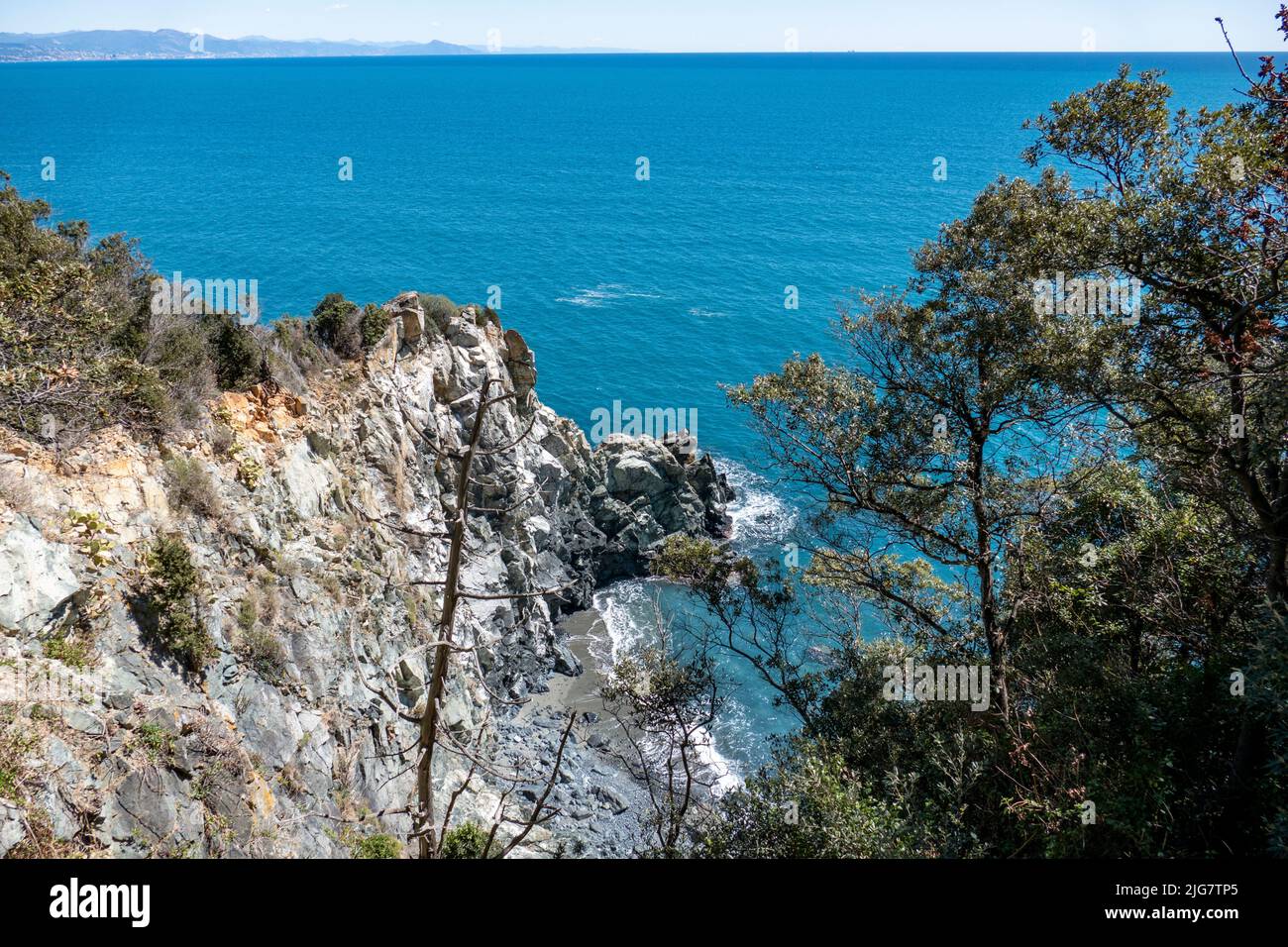 A beautiful view from a high cliff to the blue sea, surrounded by ...