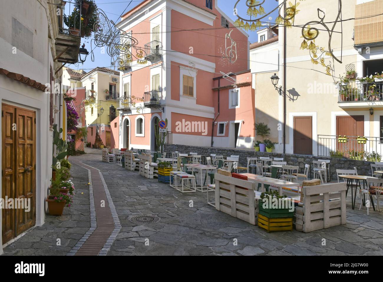 A narrow street with old buildings in San Nicola Arcella, village of ...