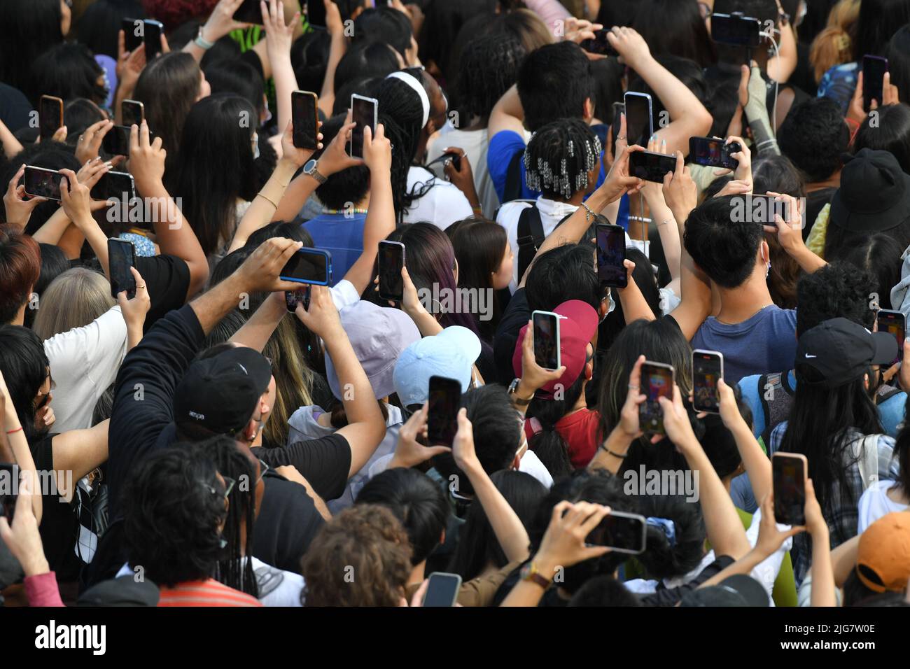 People use their cell phones to record the K-Pop girl group aespa as ...