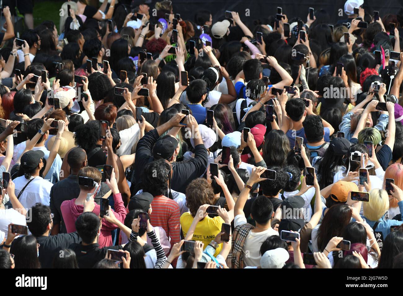 People use their cell phones to record the K-Pop girl group aespa as ...