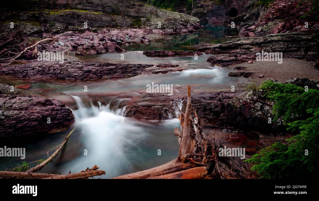 A breathtaking view of narrow stream flowing through the rocks in ...