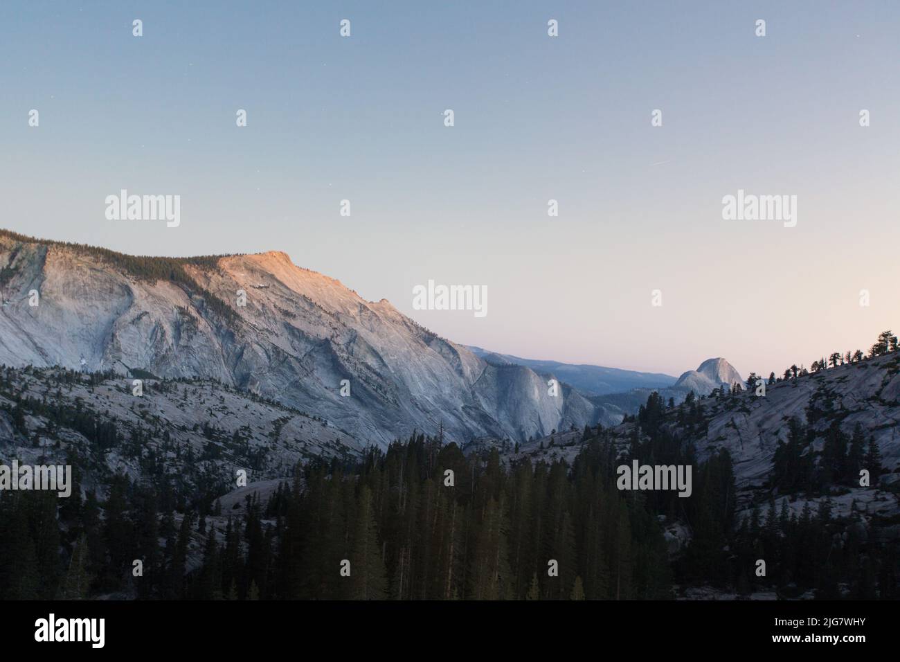 A scenic shot of snowy mountain summit during sunrise Stock Photo - Alamy