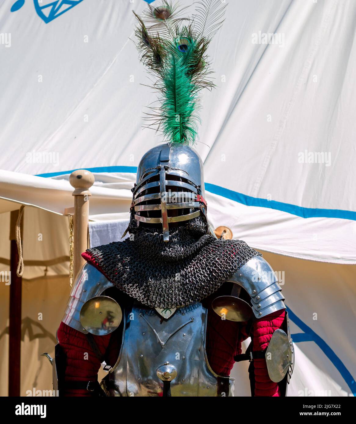 outside a camp tent of a medieval knight plate armor on a mannequin ...