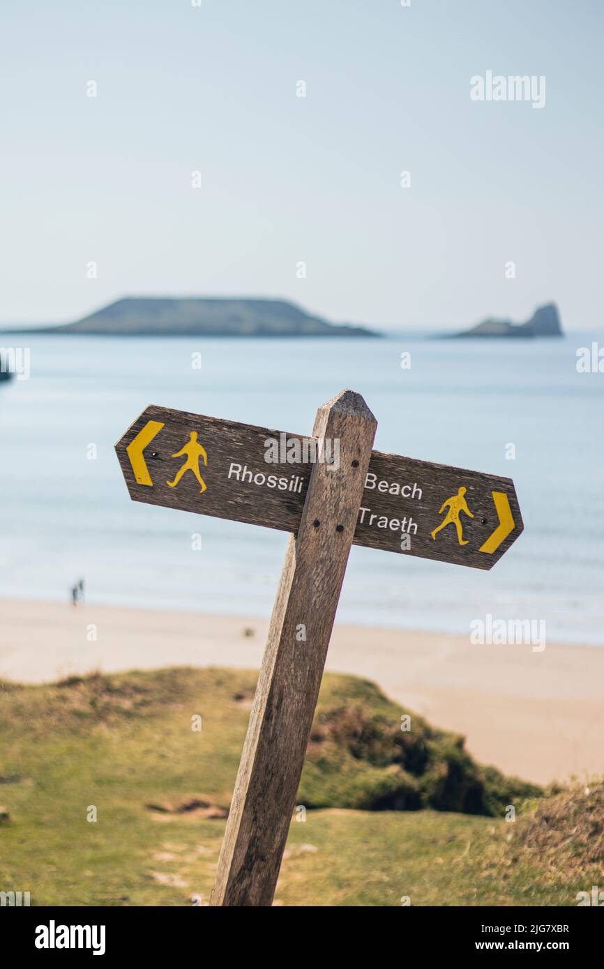 A vertical view of beach information panels- Rhossili village and ...