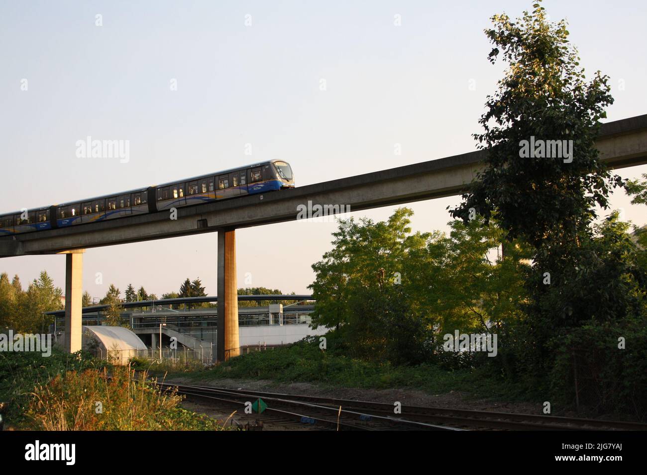 a SkyTrain moving on a bridge in East Vancouver, British Columbia ...