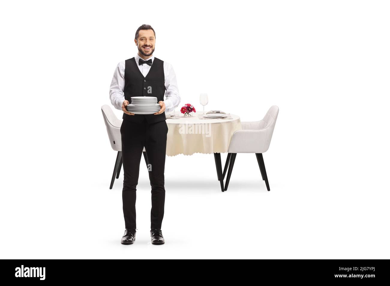 Full length portrait of a server holding a pile of plates and standing ...