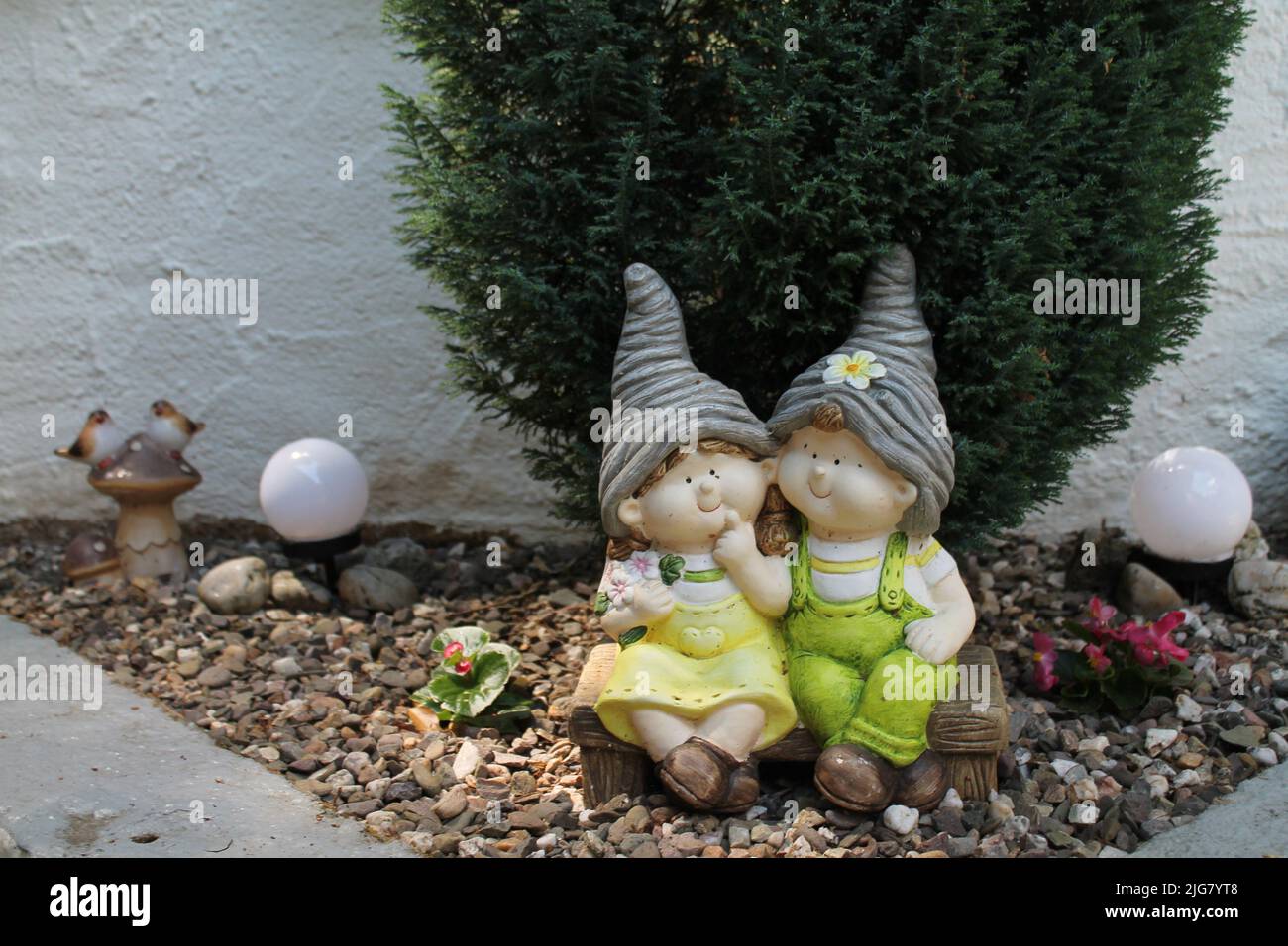 small funny figures of green clothed people Stock Photo - Alamy