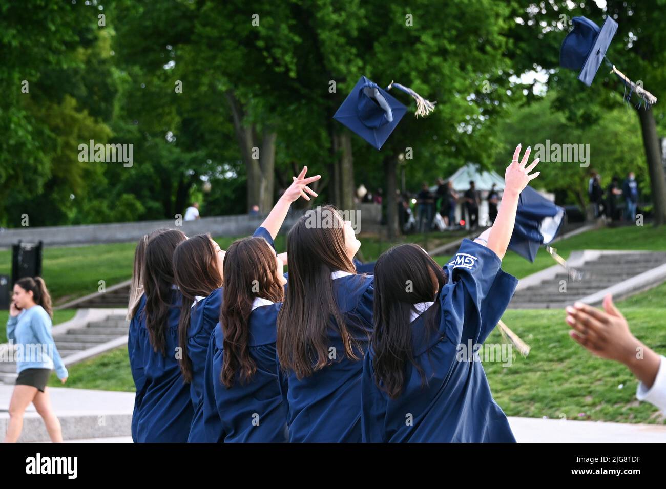 College students celebrate their graduation at the Lincoln Memorial on ...
