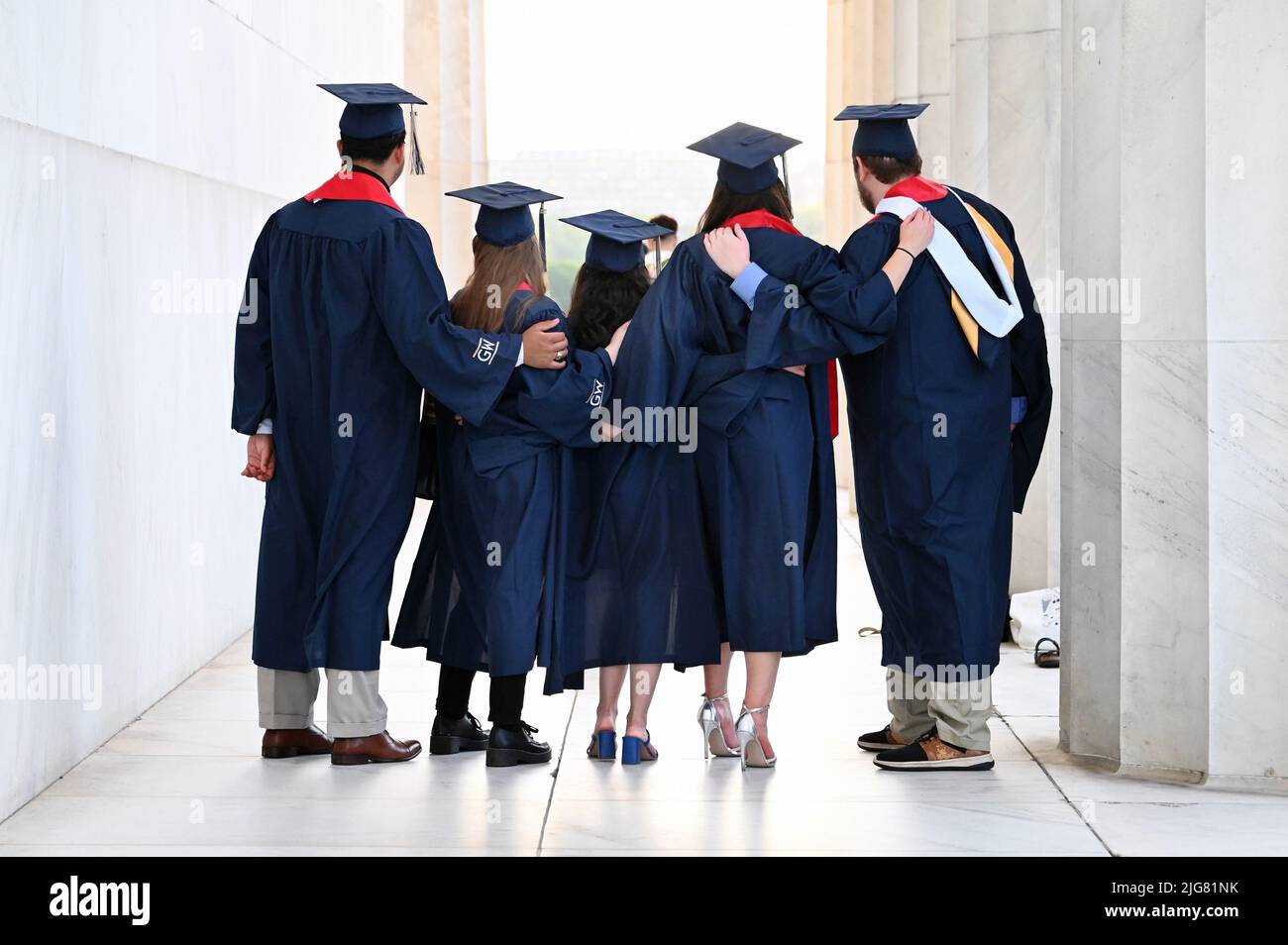 College students celebrate their graduation at the Lincoln Memorial on ...