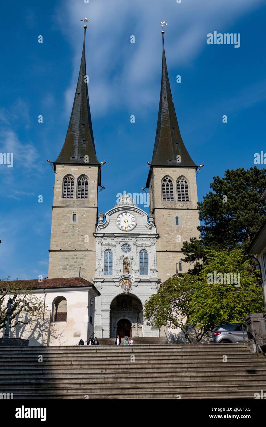 A vertical shot of an exterior of the Church of St. Leodegar in Lucerne ...