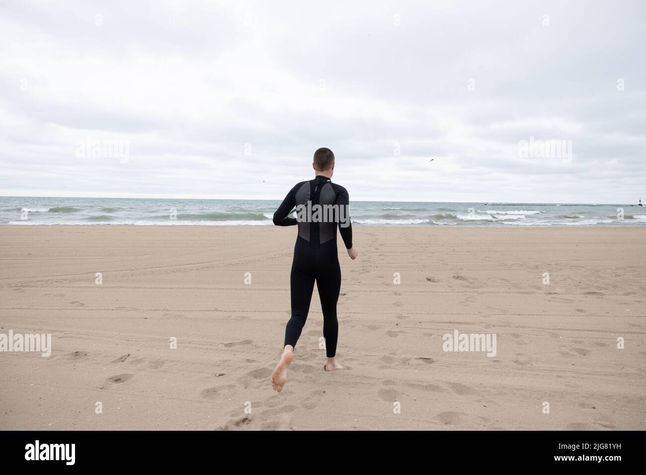 Man in suit running from behind hi-res stock photography and images - Alamy