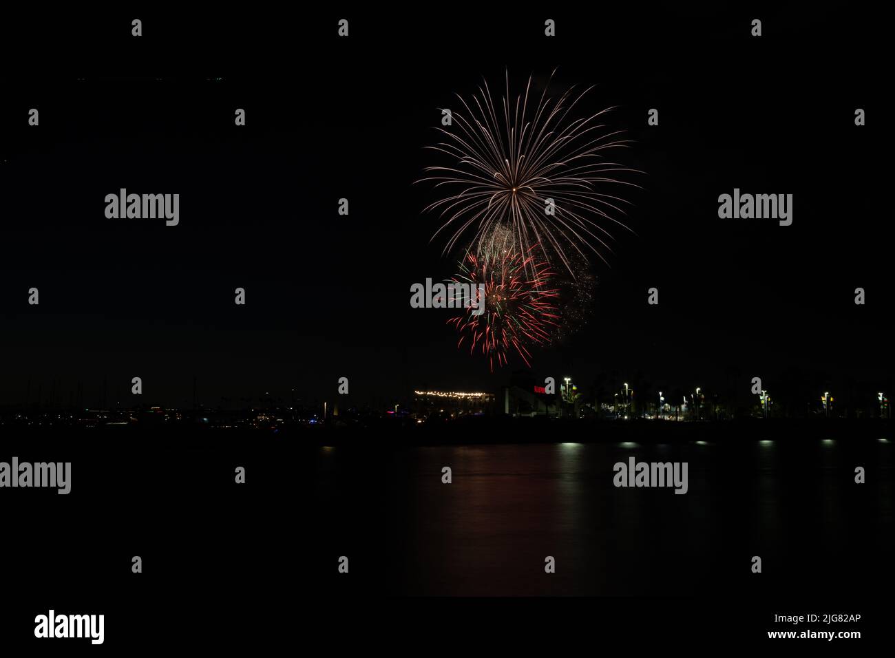 Fireworks shoot off over water of Alamitos Bay in Long Beach, CA to ...