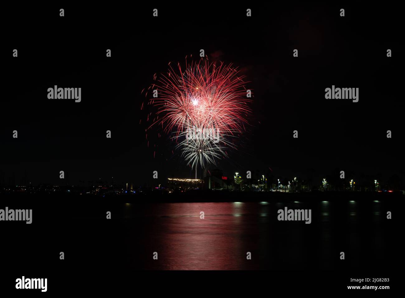 Fireworks shoot over water of Alamitos Bay in Long Beach, CA to ...