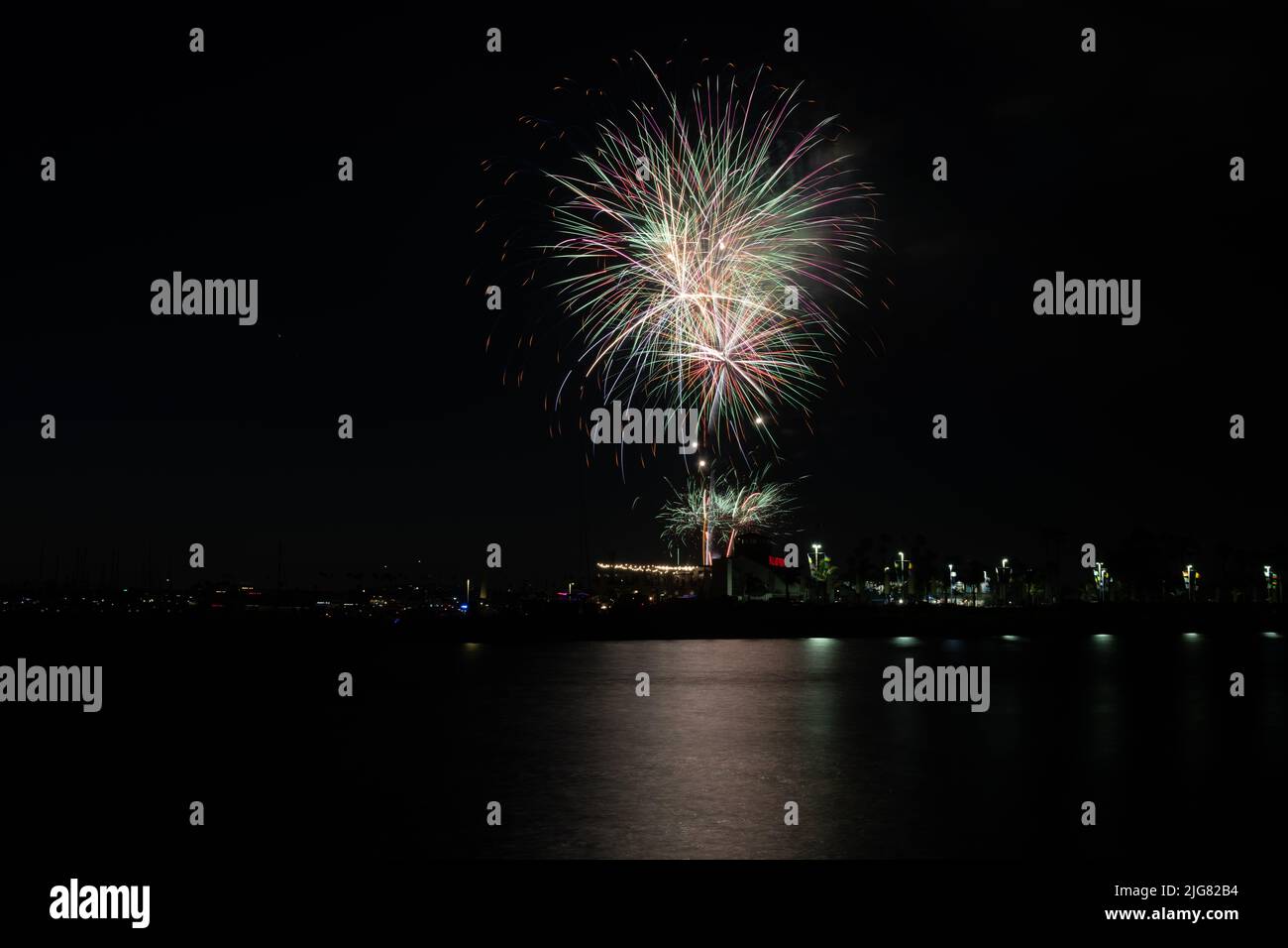 Fireworks shoot off over water of Alamitos Bay in Long Beach, CA to ...