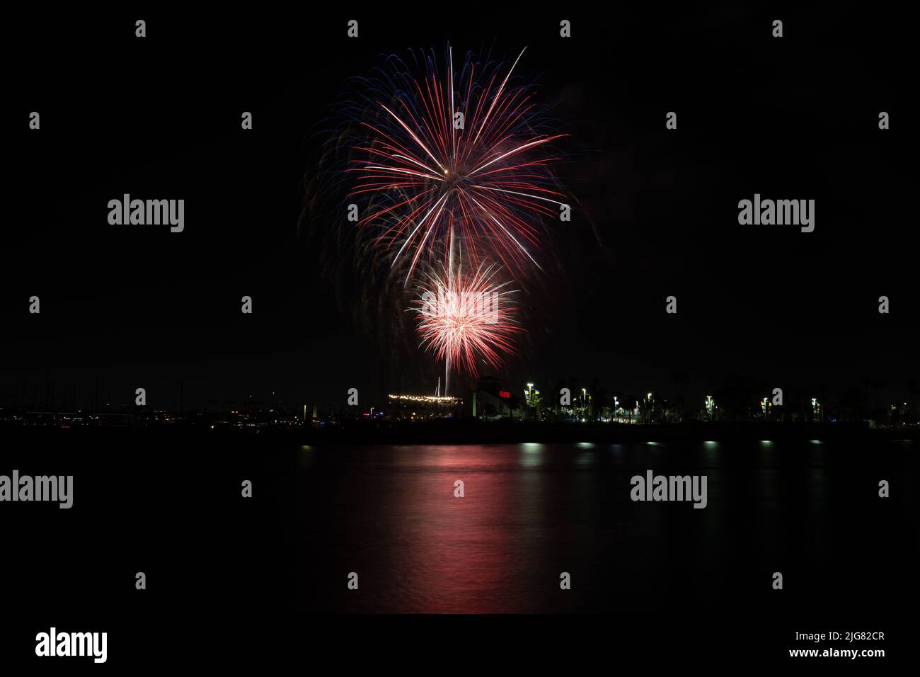 Fireworks shoot over water of Alamitos Bay in Long Beach, CA to ...
