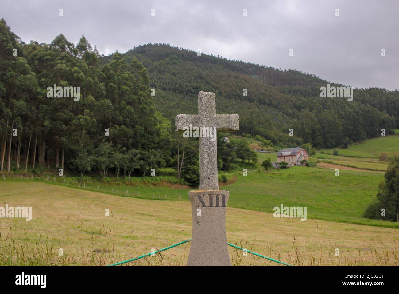 christian cross by the road in the way to a church Stock Photo - Alamy