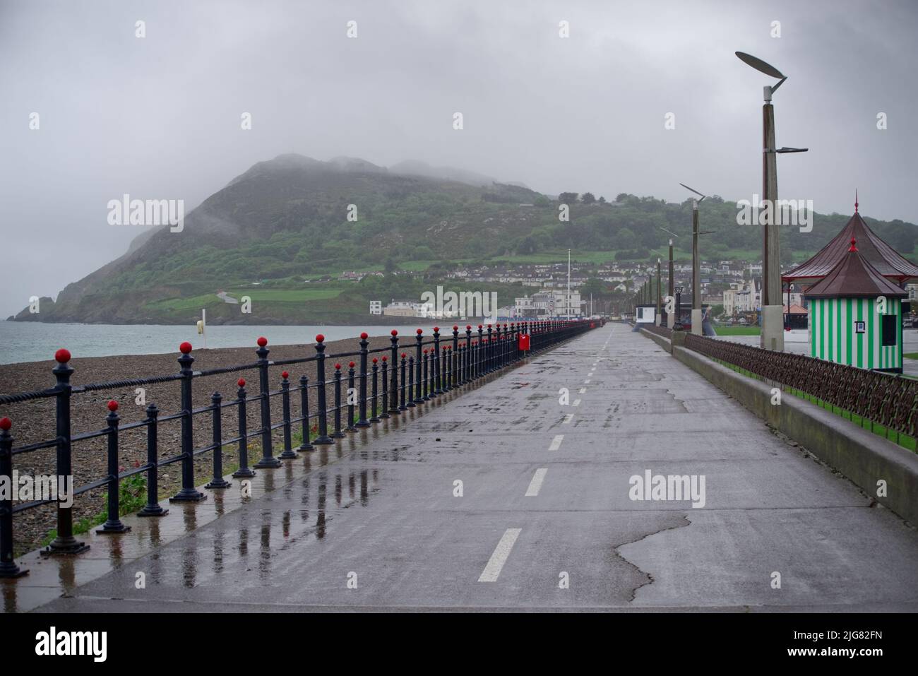 Bray Promenade, empty in the rain. The Bray Head mountain visible on ...