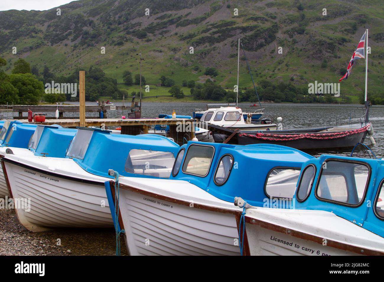 Blue pleasure boats on Ullswater, Cumbria Stock Photo - Alamy