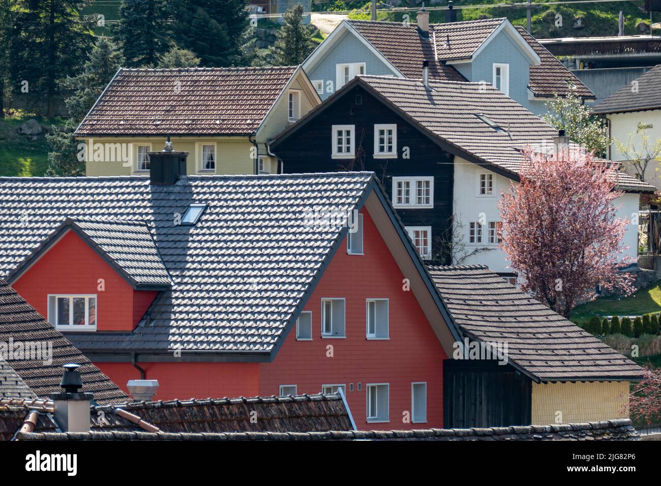 A beautiful shot of European houses with shingle roofing next to each ...