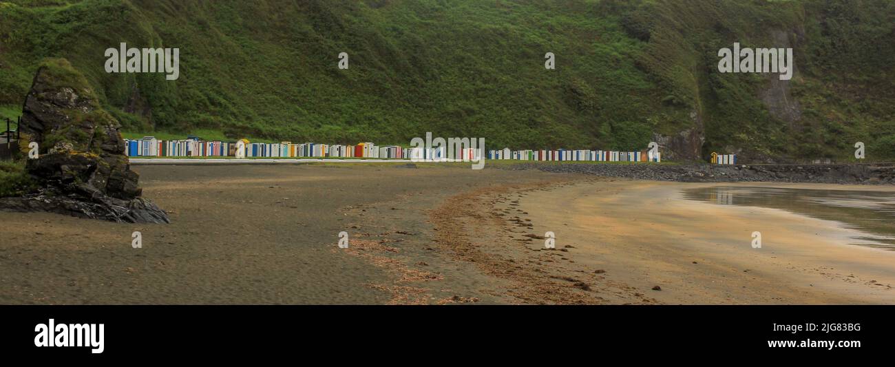 there are huts of many colors in Luarca beach in Spain Stock Photo - Alamy
