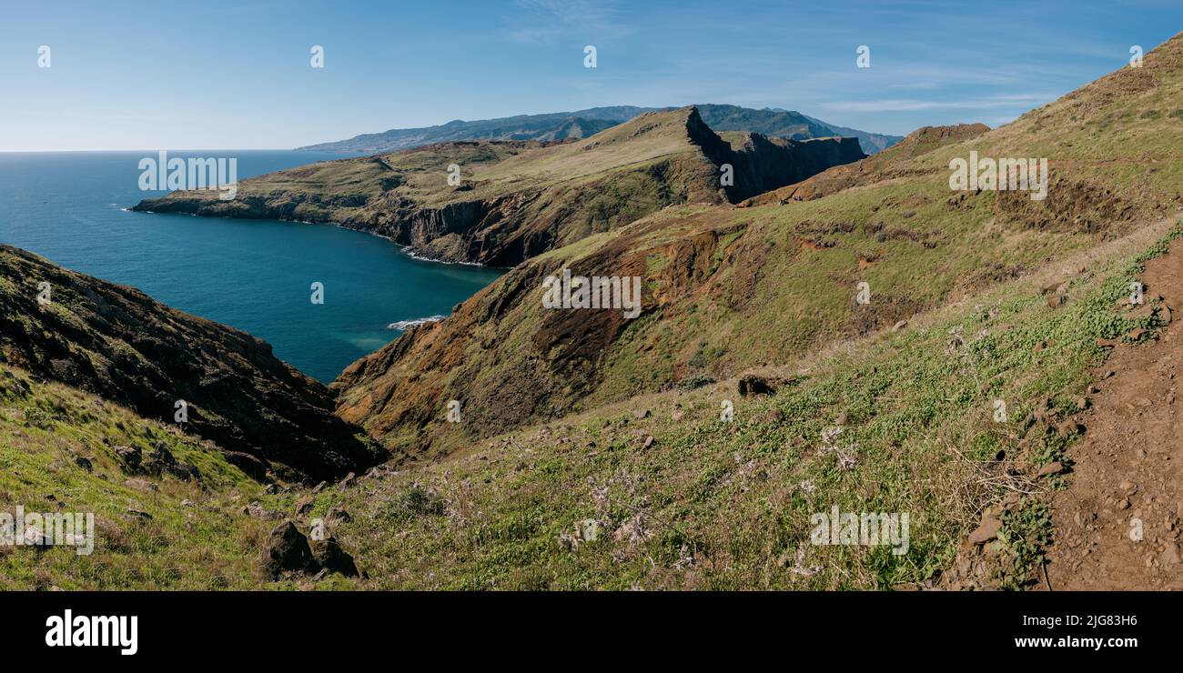 A calm sea and rocks on a bright day in Madeira, Portugal Stock Photo ...