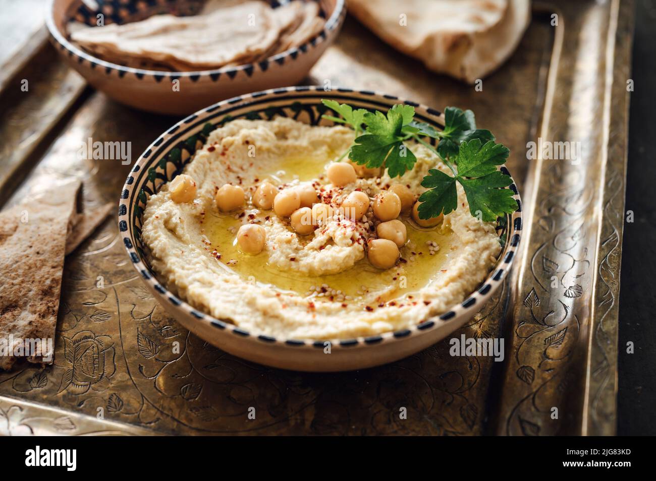 Homemade delicious chickpea hummus with olive oil, parsley Stock Photo ...