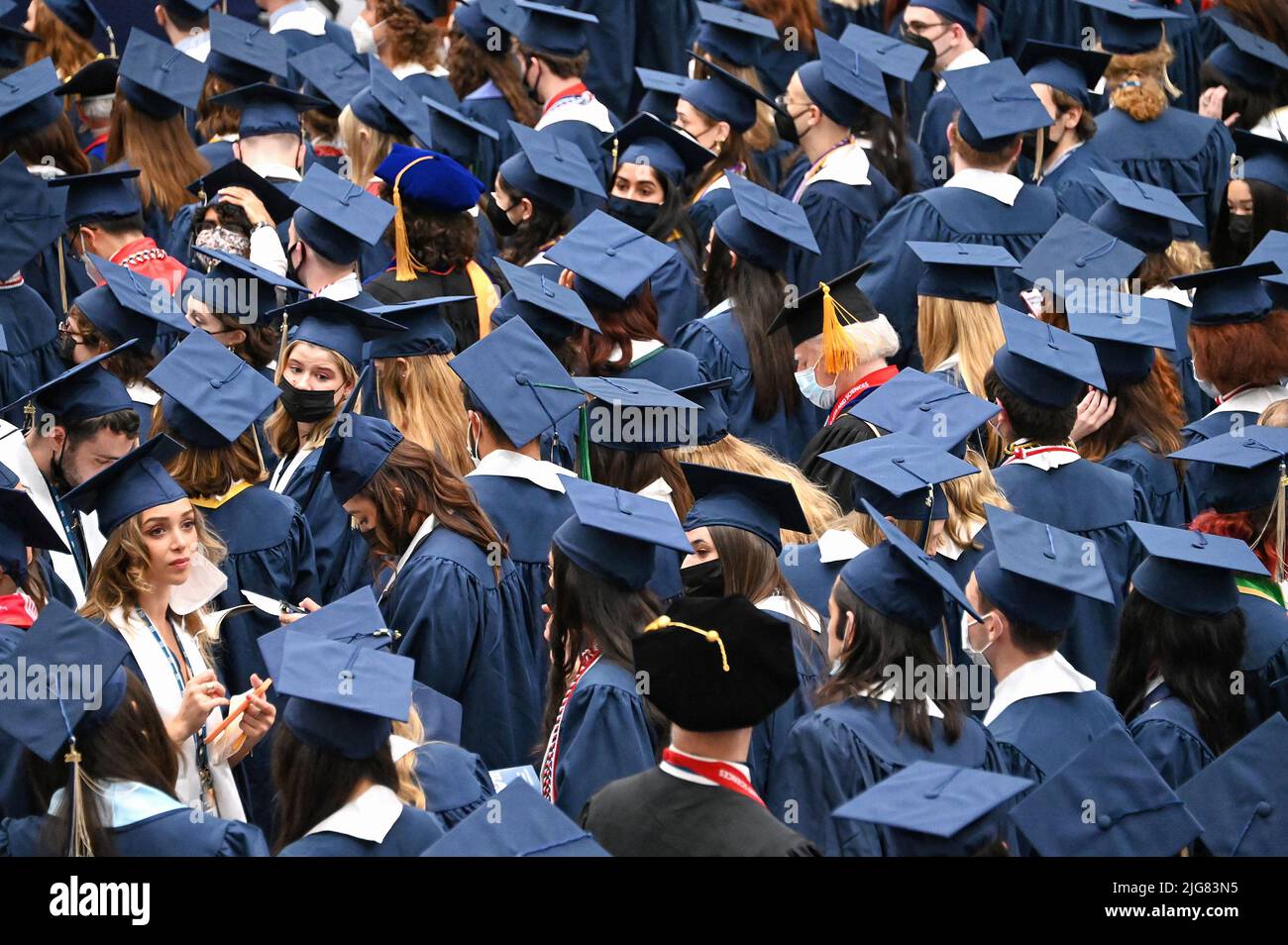 George Washington University college students in traditional robe and mortarboard on graduation ...