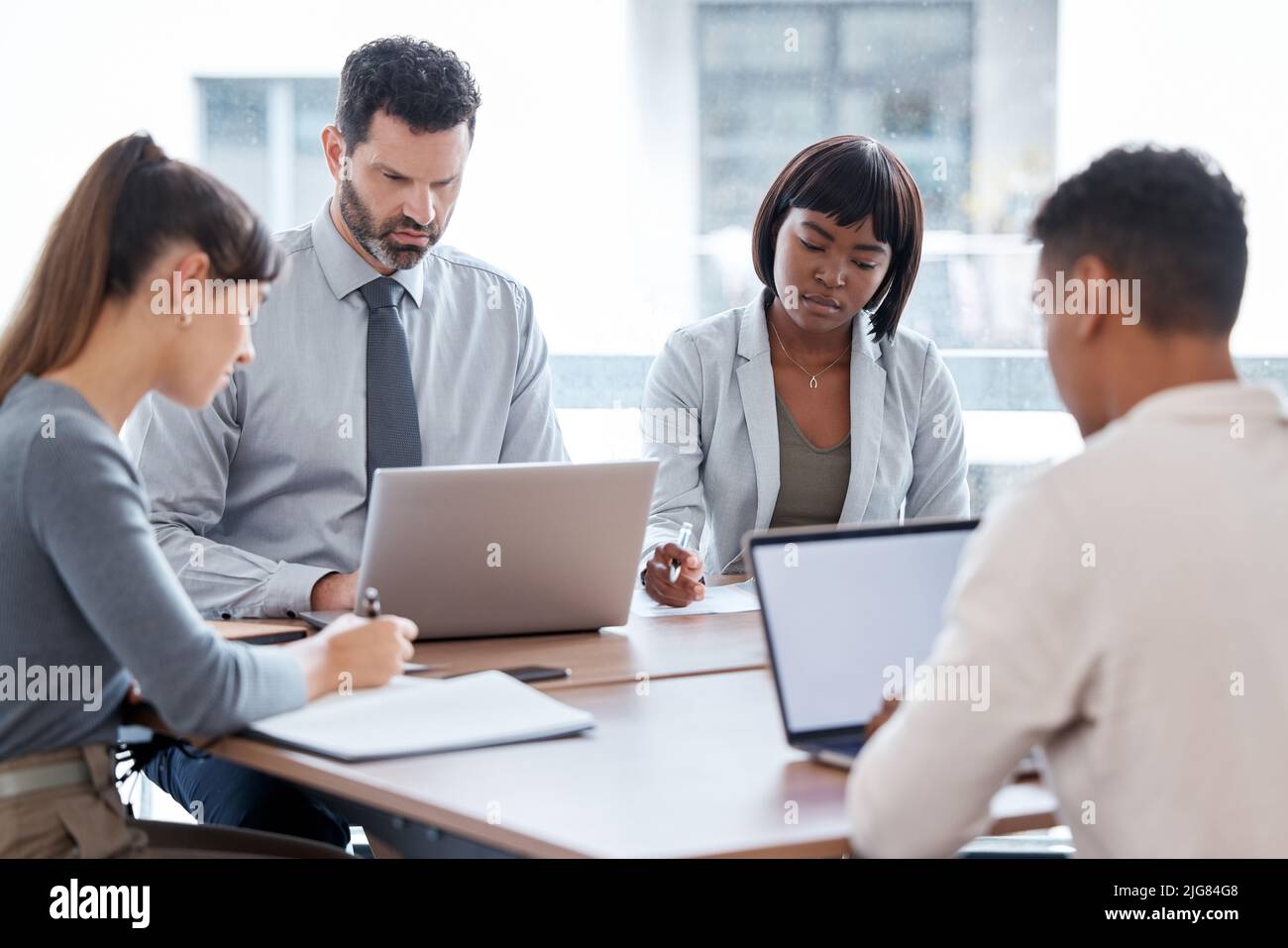 Meeting in session. Cropped shot of a group of businesspeople having a ...