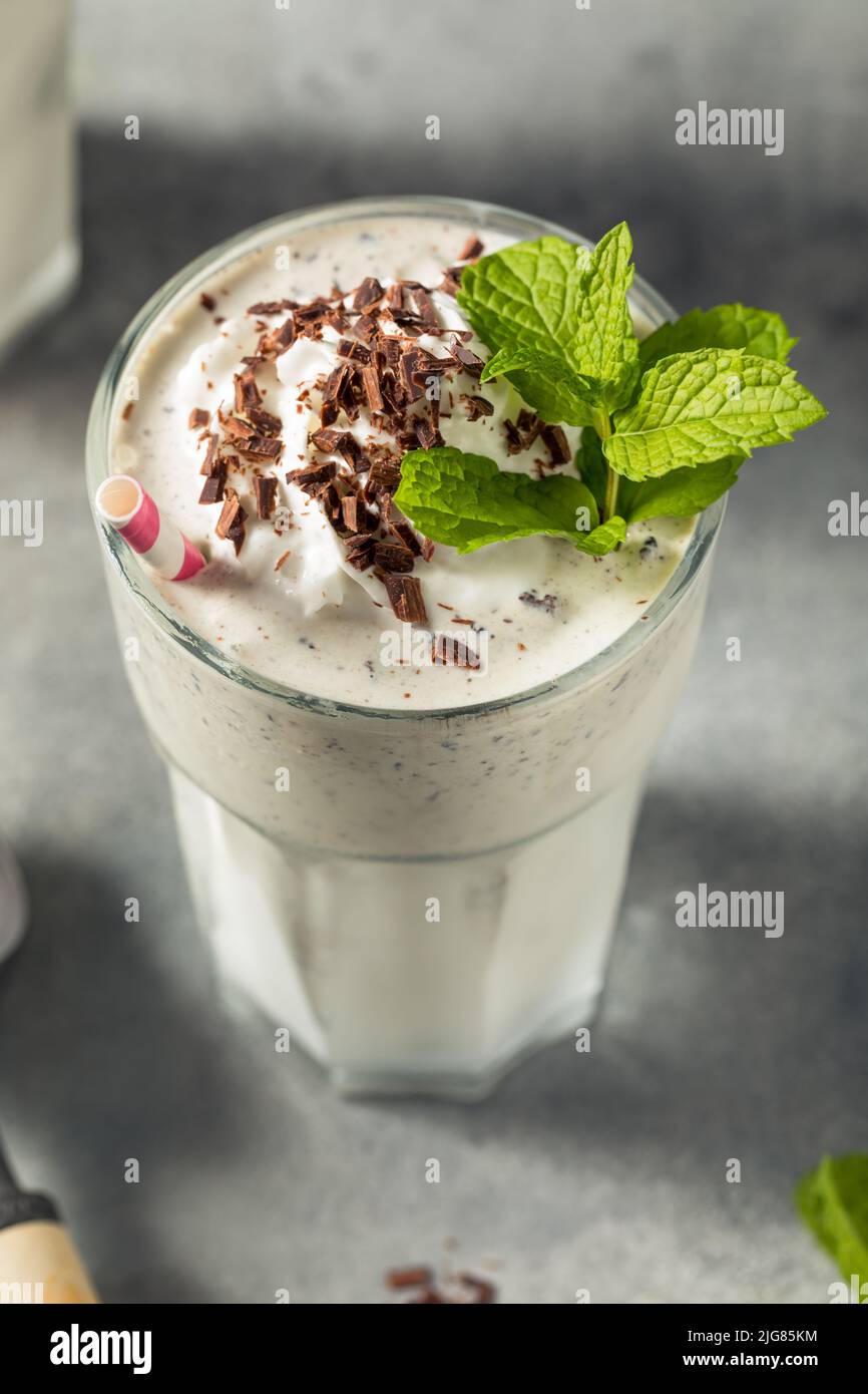 Homemade Green Chocolate Chip Mint Milkshake in a Glass Stock Photo - Alamy