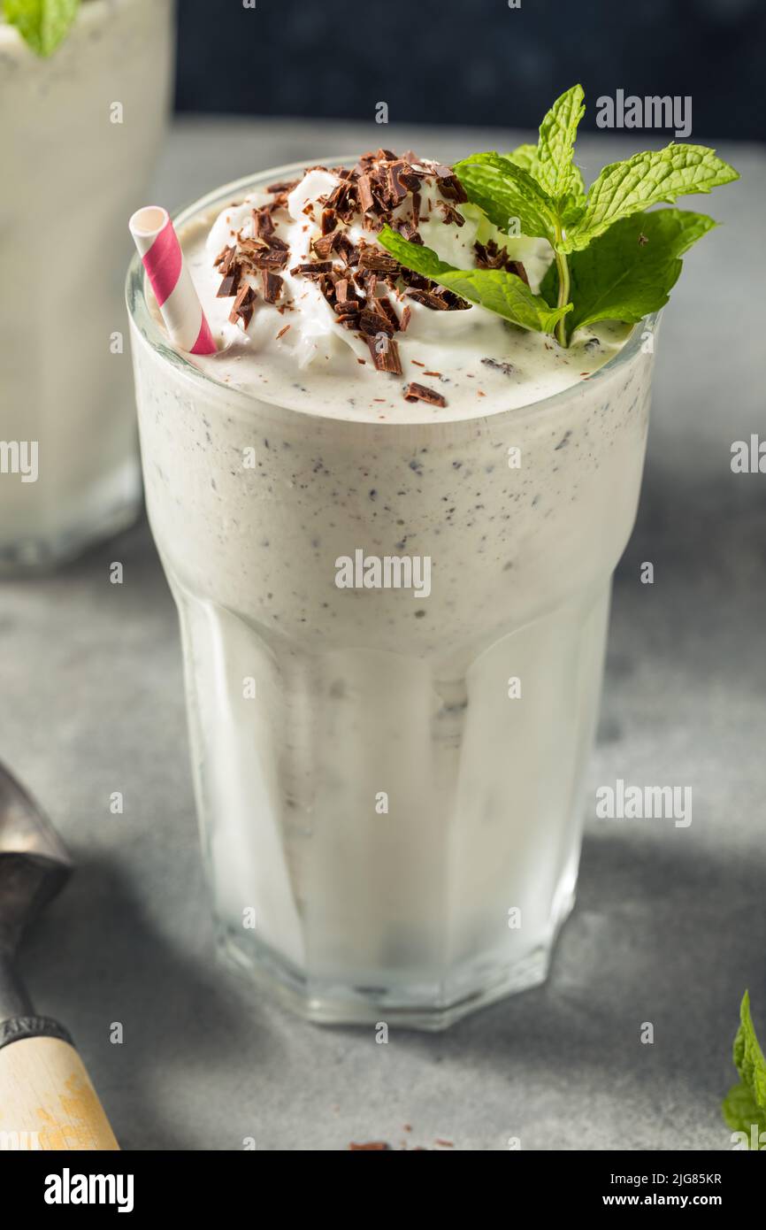 Homemade Green Chocolate Chip Mint Milkshake in a Glass Stock Photo - Alamy