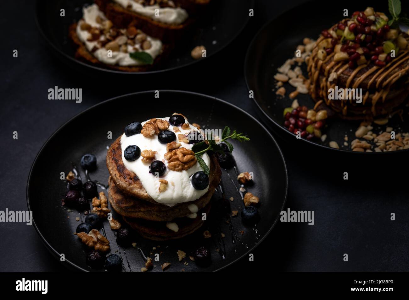 Perfect breakfast american pancakes stack served on a black stone table ...