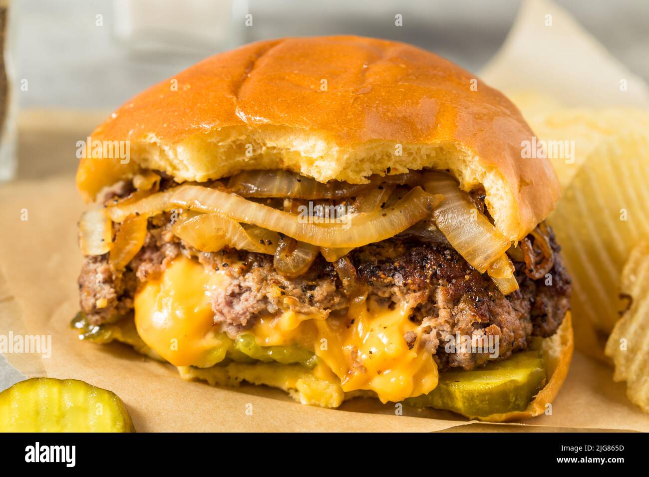 Homemade Juicy Lucy Cheeseburger with Cheddar and Chips Stock Photo - Alamy