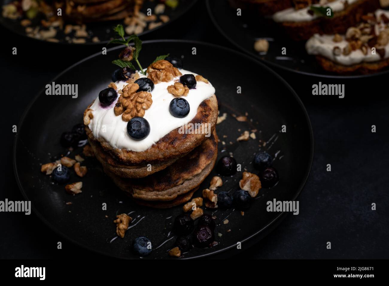 Perfect breakfast american pancakes stack served on a black stone table ...